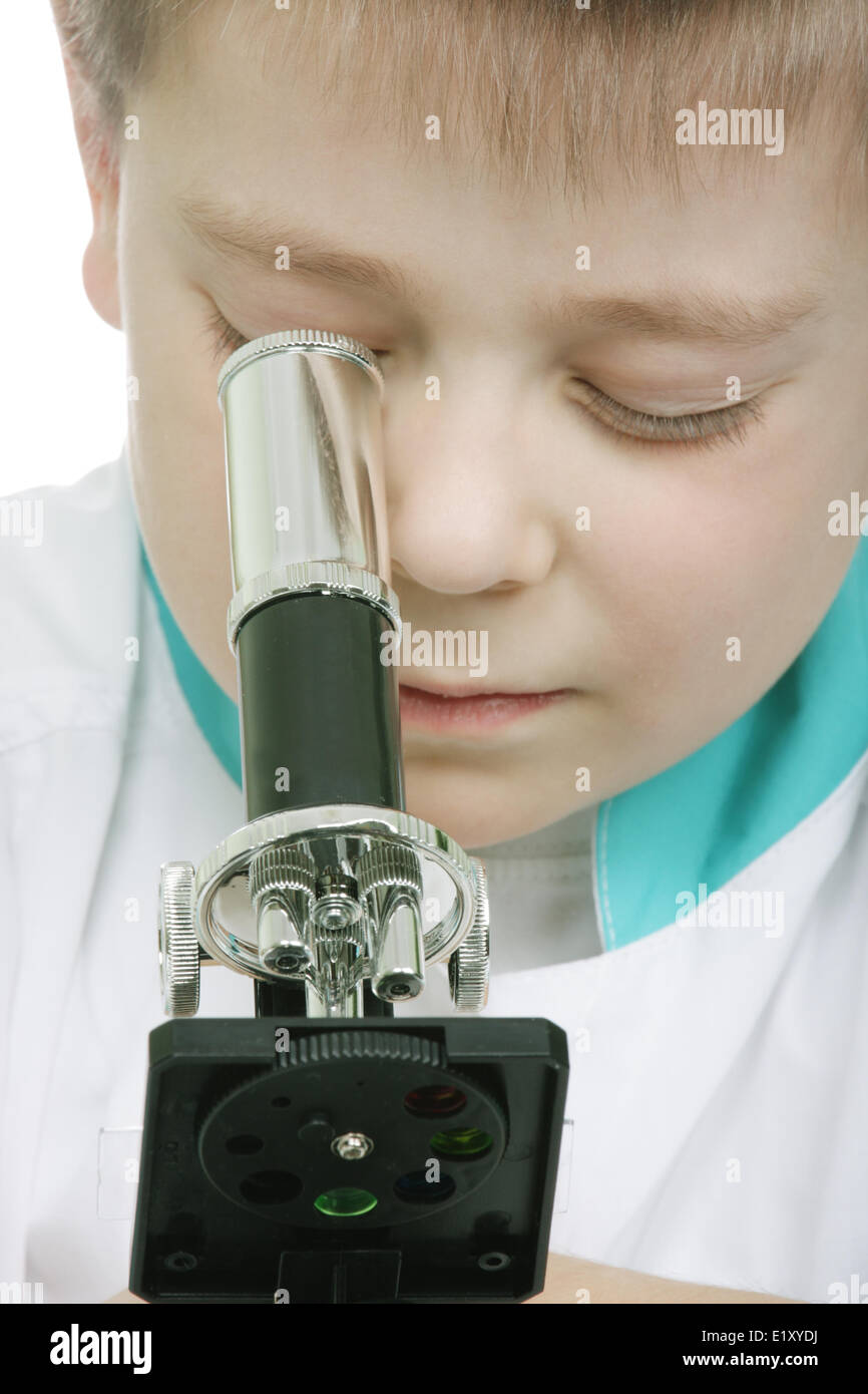 Looking to microscope Stock Photo - Alamy