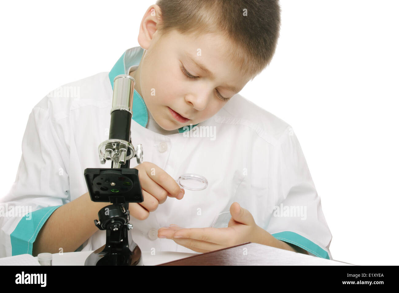 Examining with magnifier glass Stock Photo - Alamy