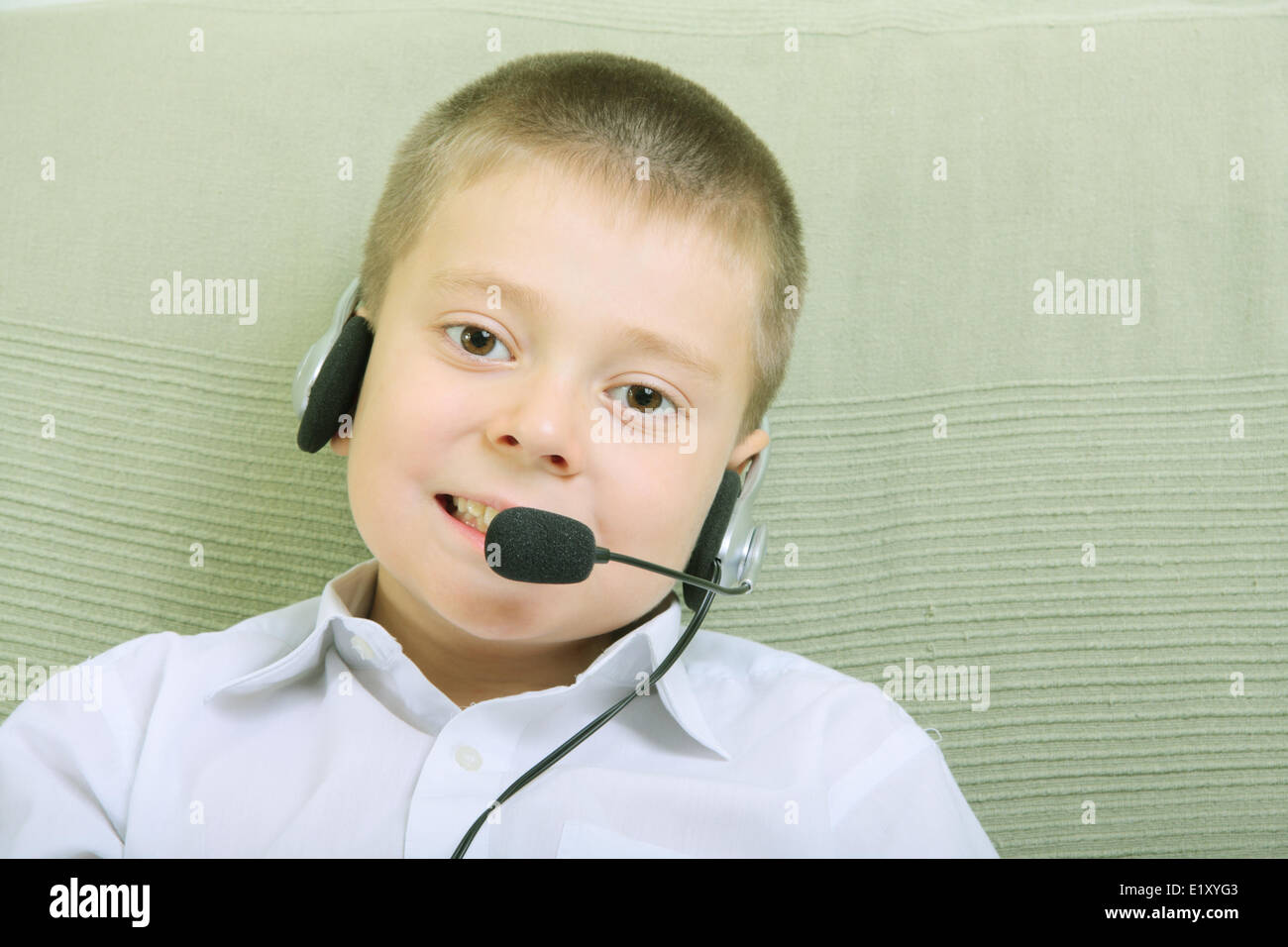 Boy with headset phone Stock Photo - Alamy