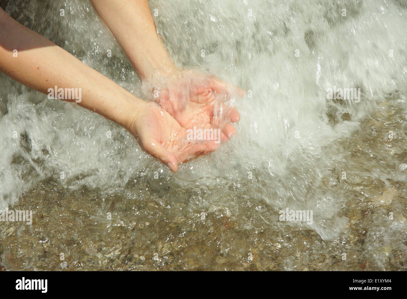 Hands in sea water Stock Photo - Alamy