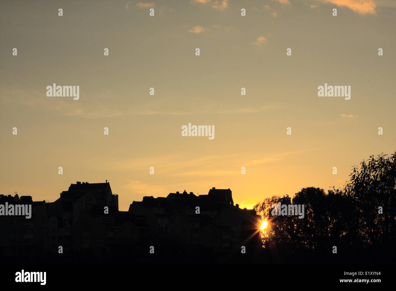 Sunset in city outline Stock Photo - Alamy
