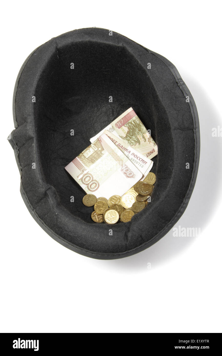 Money in hat Stock Photo - Alamy