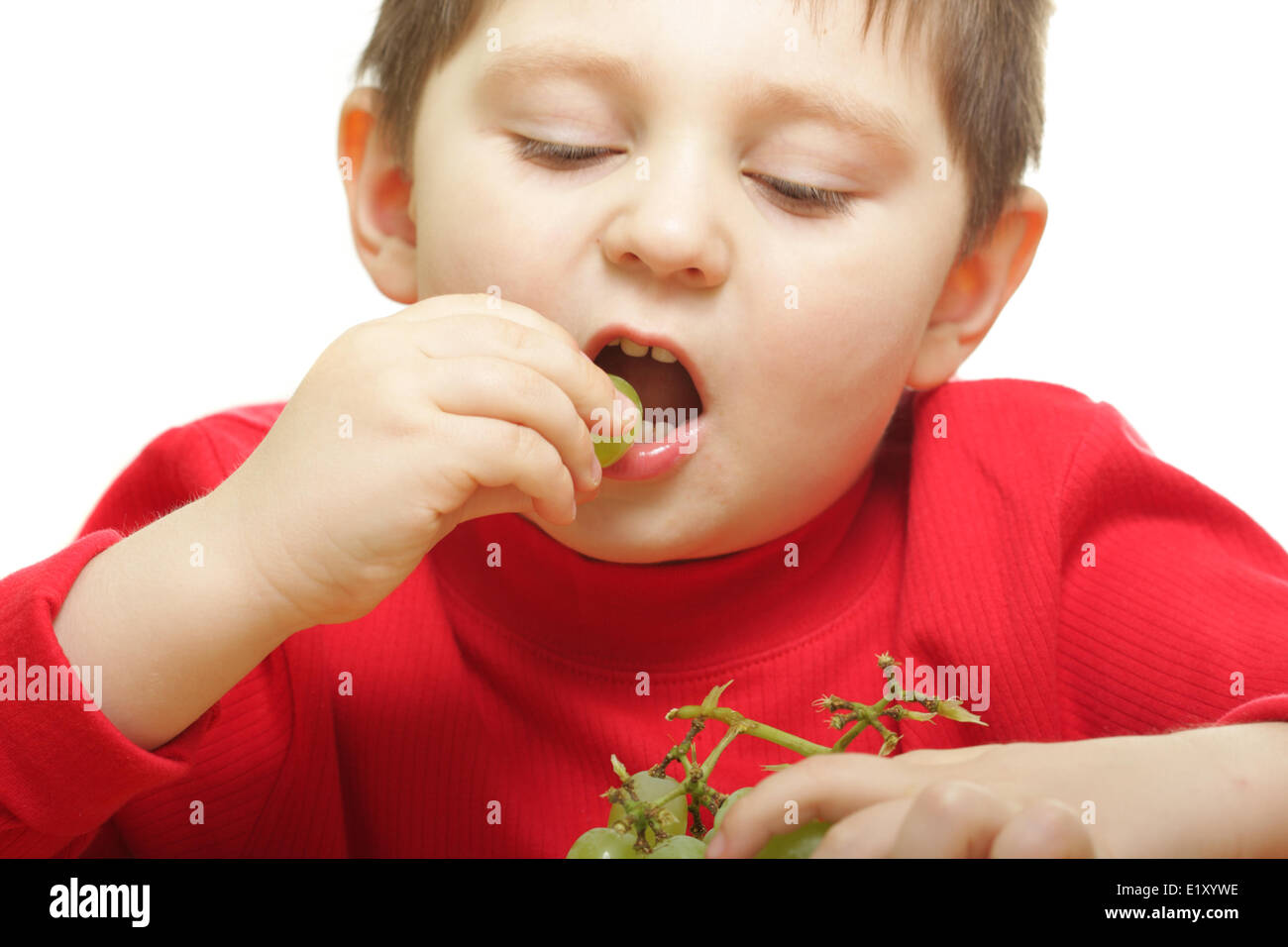 Boy eating grapes child hi-res stock photography and images - Alamy