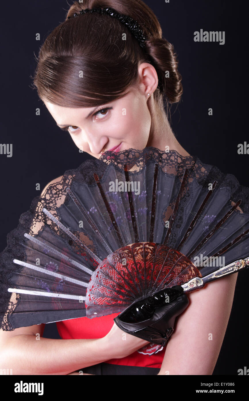 Woman with fan Stock Photo - Alamy