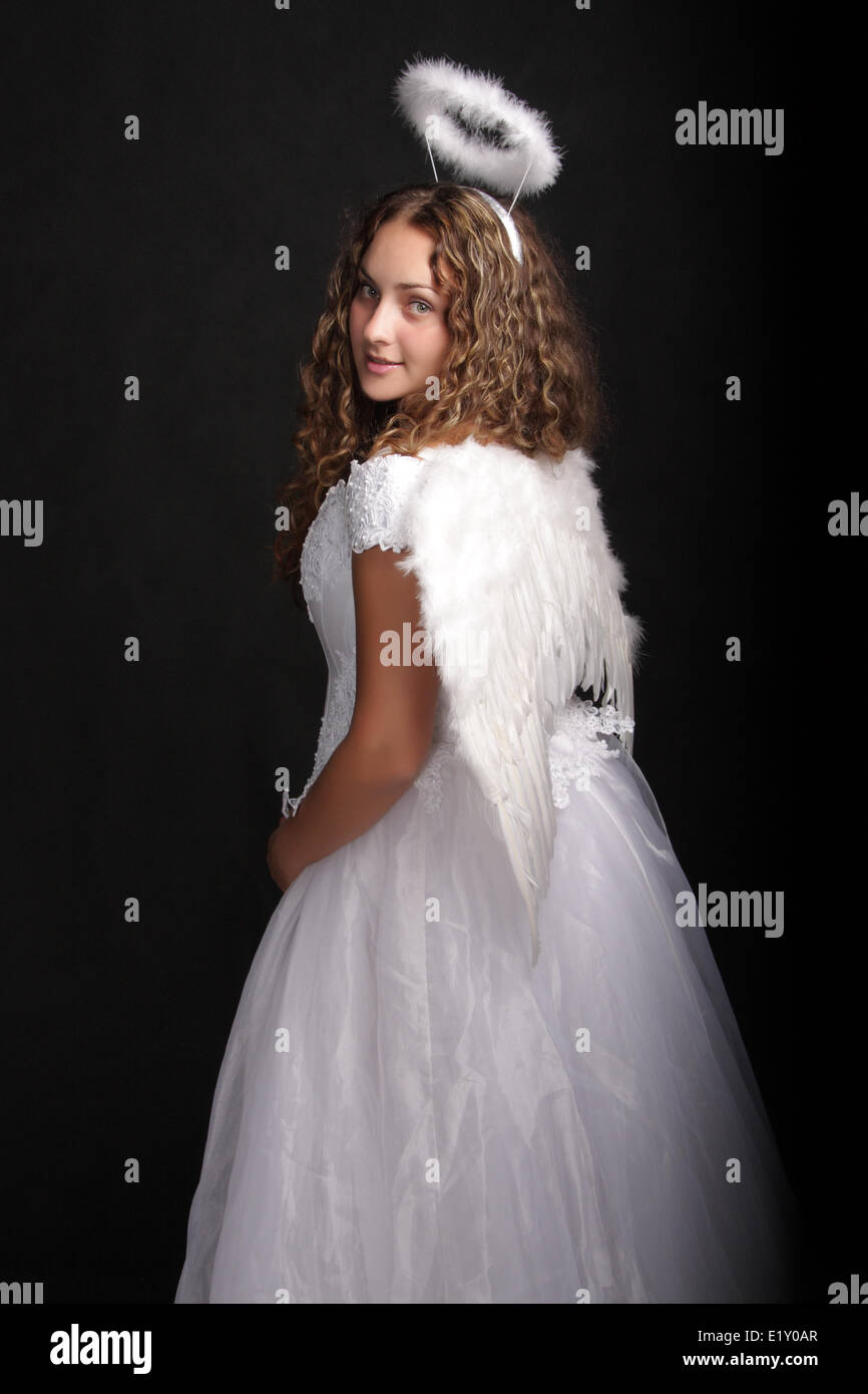 Angel looking over shoulder Stock Photo - Alamy