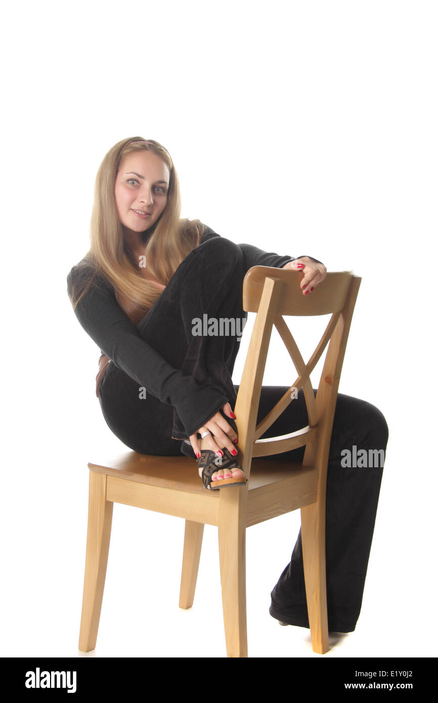 Girl on chair Stock Photo - Alamy