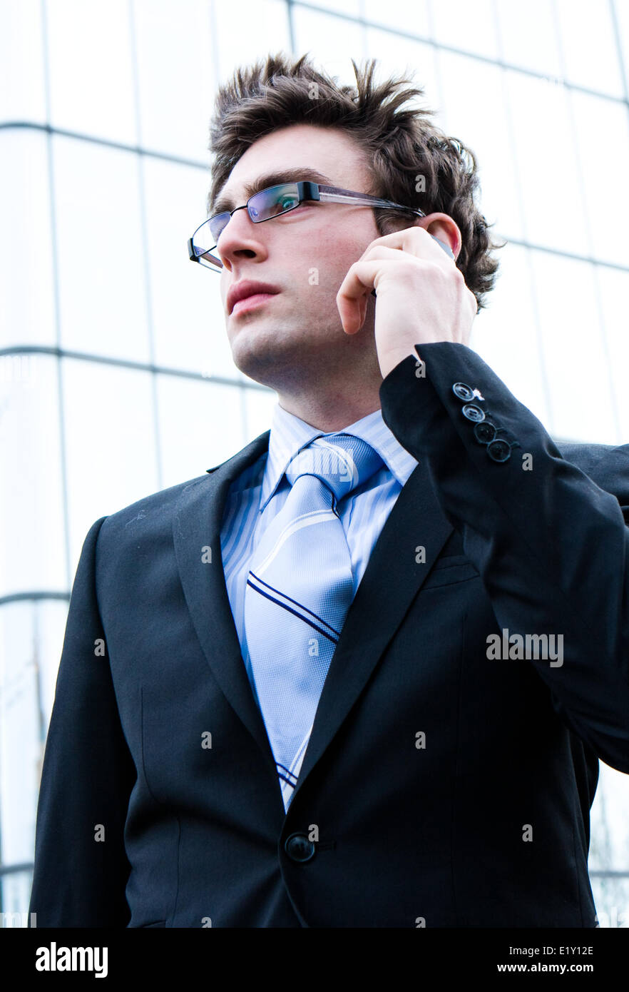 business man speaking over the mobile phone Stock Photo - Alamy