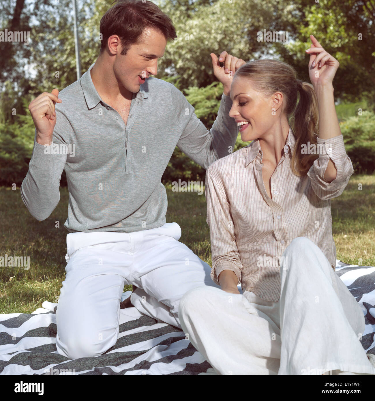 happy couple in love resting in the park Stock Photo - Alamy