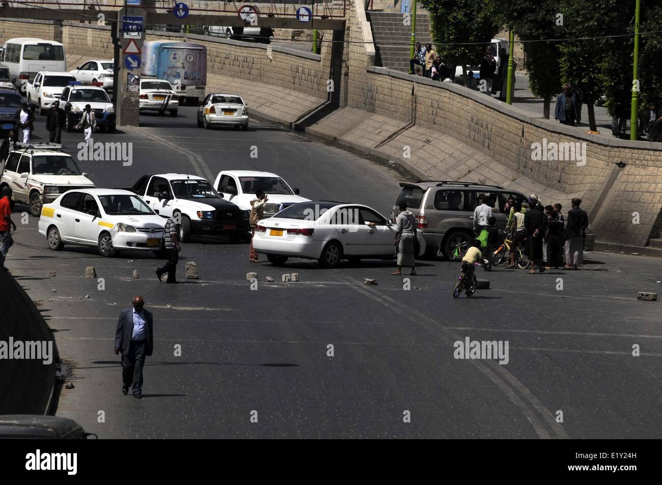 Sanaa, Yemen. 11th June, 2014. Yemenis block a road and burn tires ...
