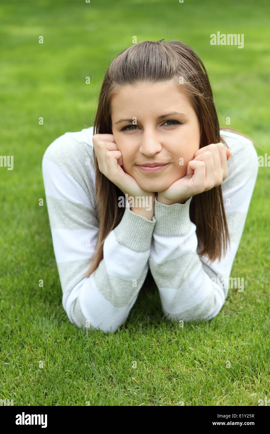 Young girl on the green grass Stock Photo - Alamy
