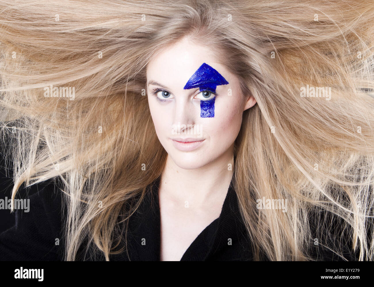 Portrait of a young woman with flying Stock Photo - Alamy