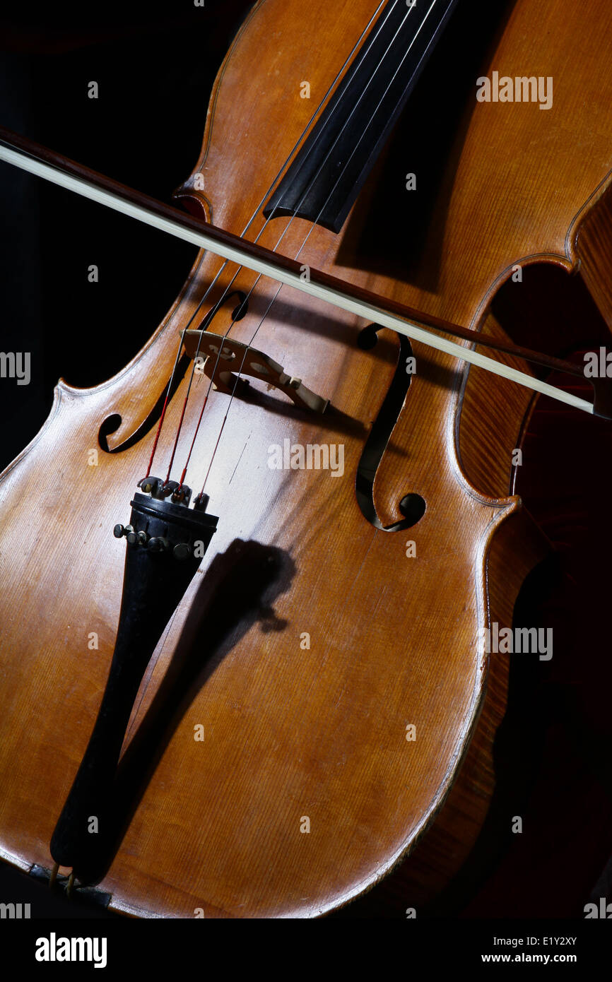 Cello on black Stock Photo - Alamy
