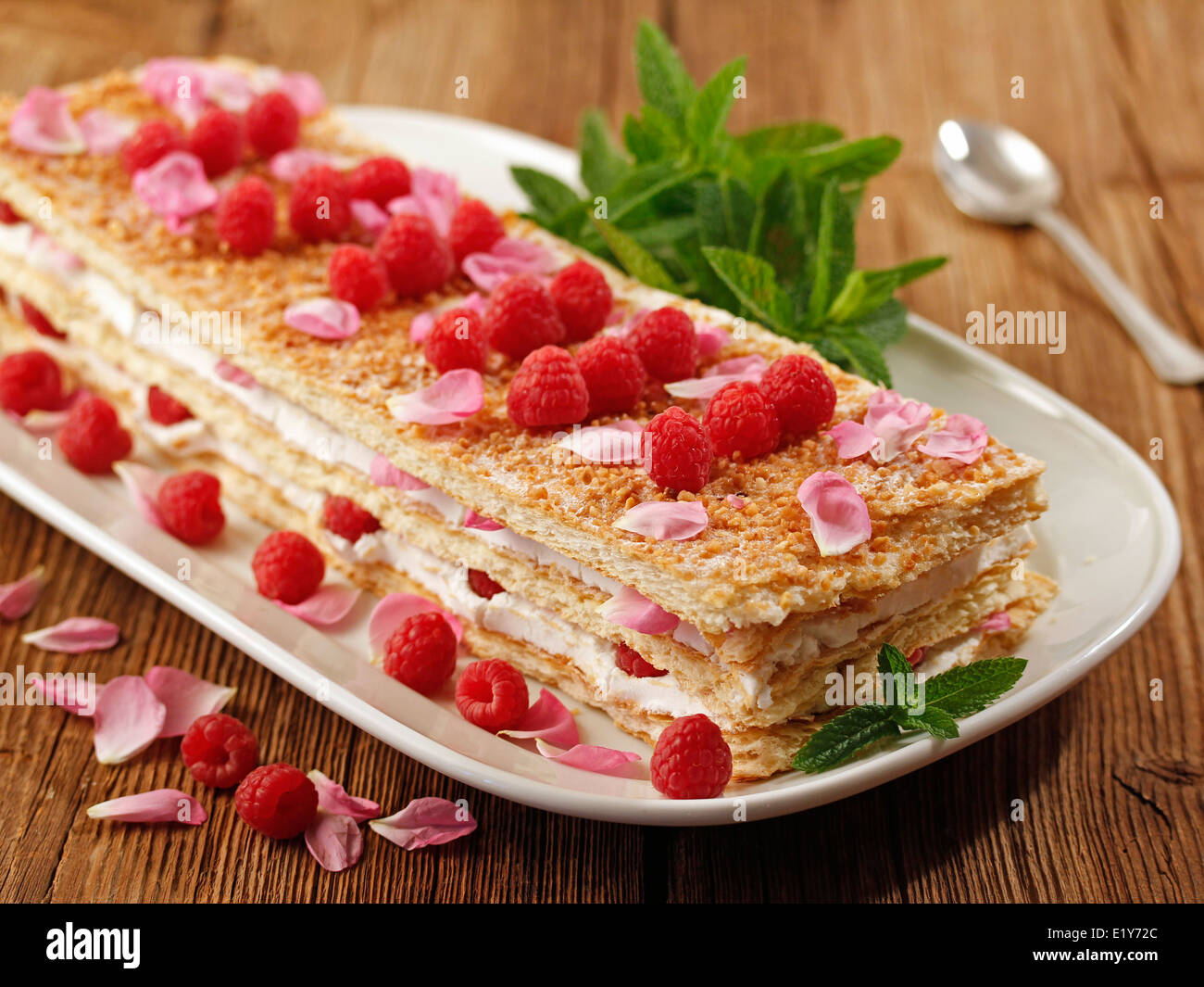 Millefeuille with raspberries and roses. Recipe available Stock Photo ...