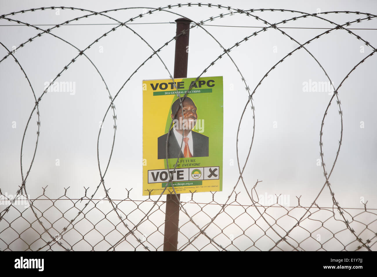 APC poster showing a face of Themba Godi (president) hanging on a fence ...