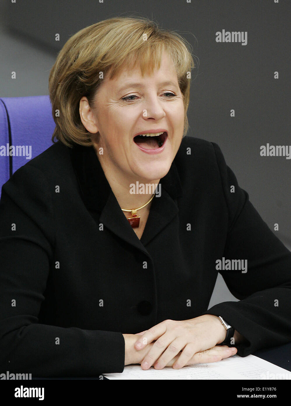 German chancellor Angela Merkel laughs during a Bundestag meeting on ...
