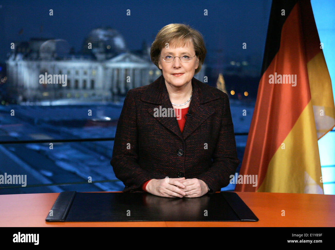 Chancellor Angela Merkel (CDU) sits next to the German flag during the ...