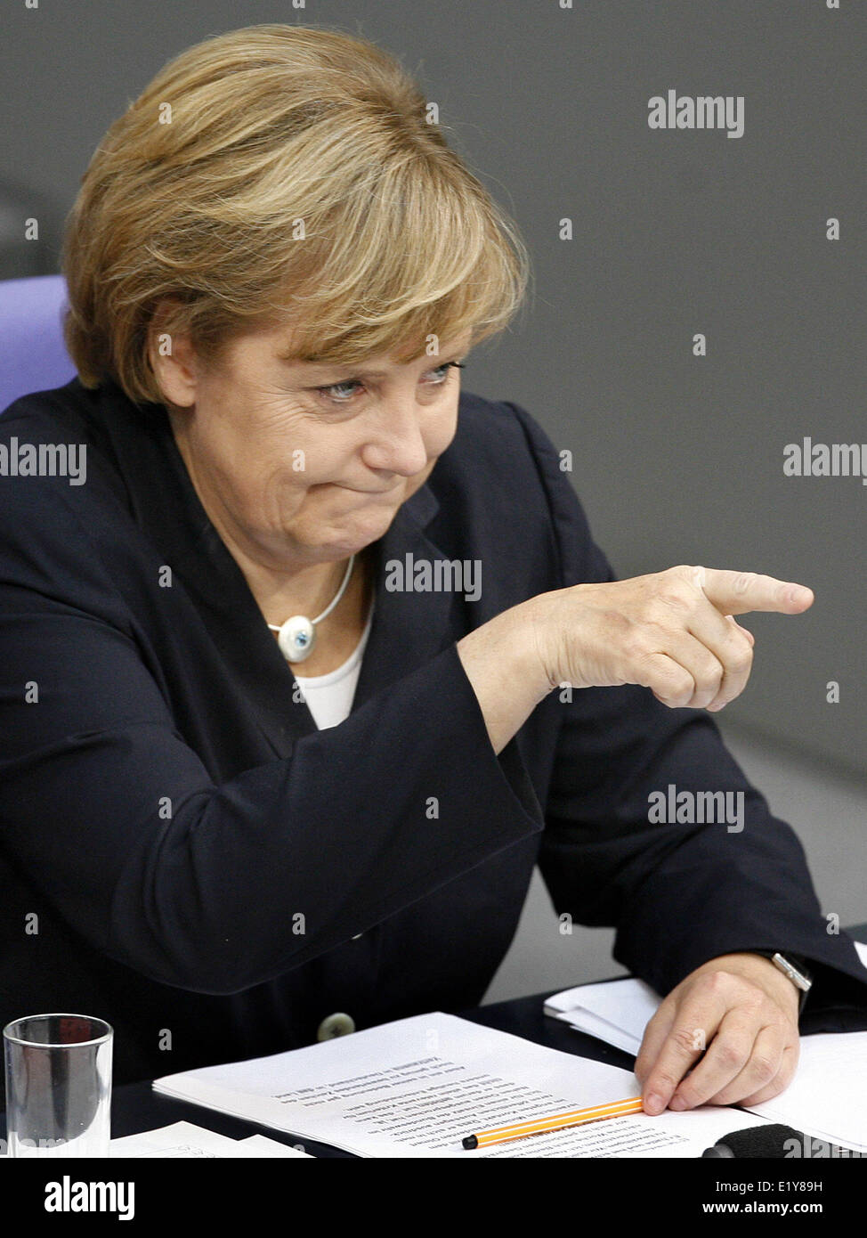 German chancellor holds up her index finger in the Bundestag on the ...