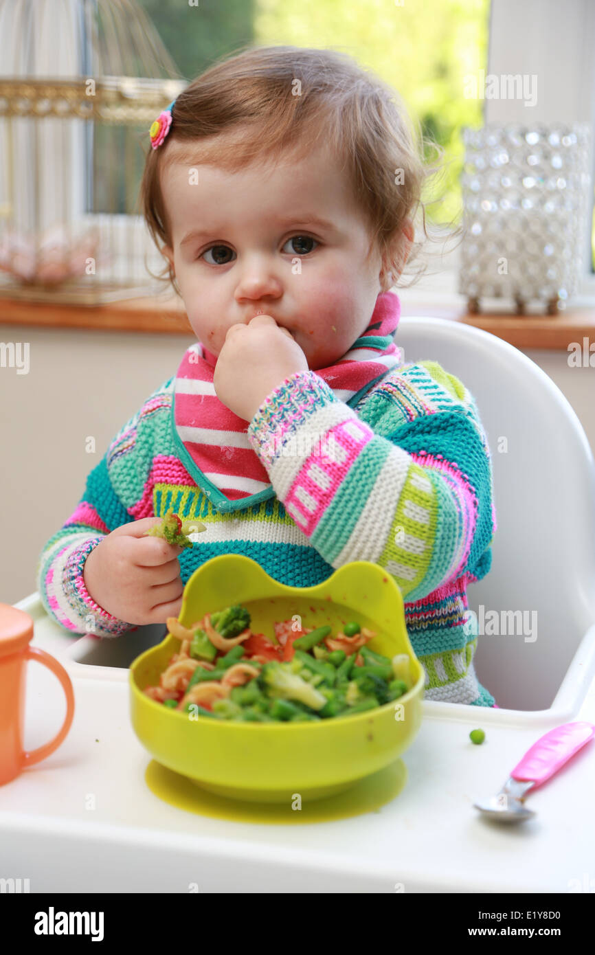 Toddler eating a healthy lunch Stock Photo - Alamy