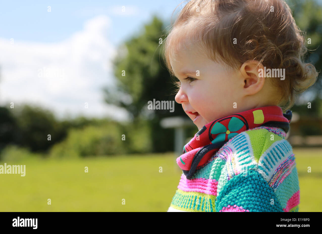 Toddler playing outside Stock Photo - Alamy