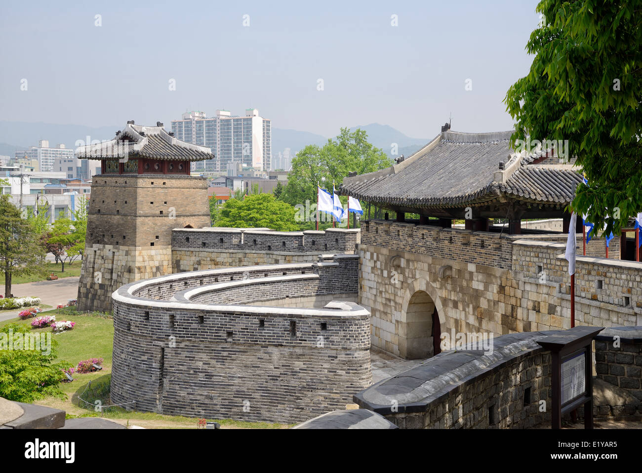 Hwaseomun is the west gate to Hwaseong. Its stone base is capped with a ...