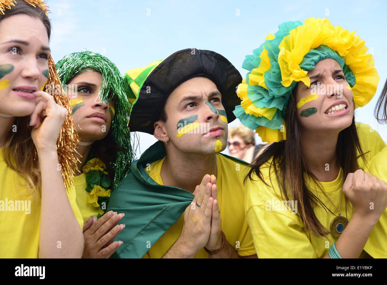 Group of brazilian soccer fans concerned with the performance of the ...