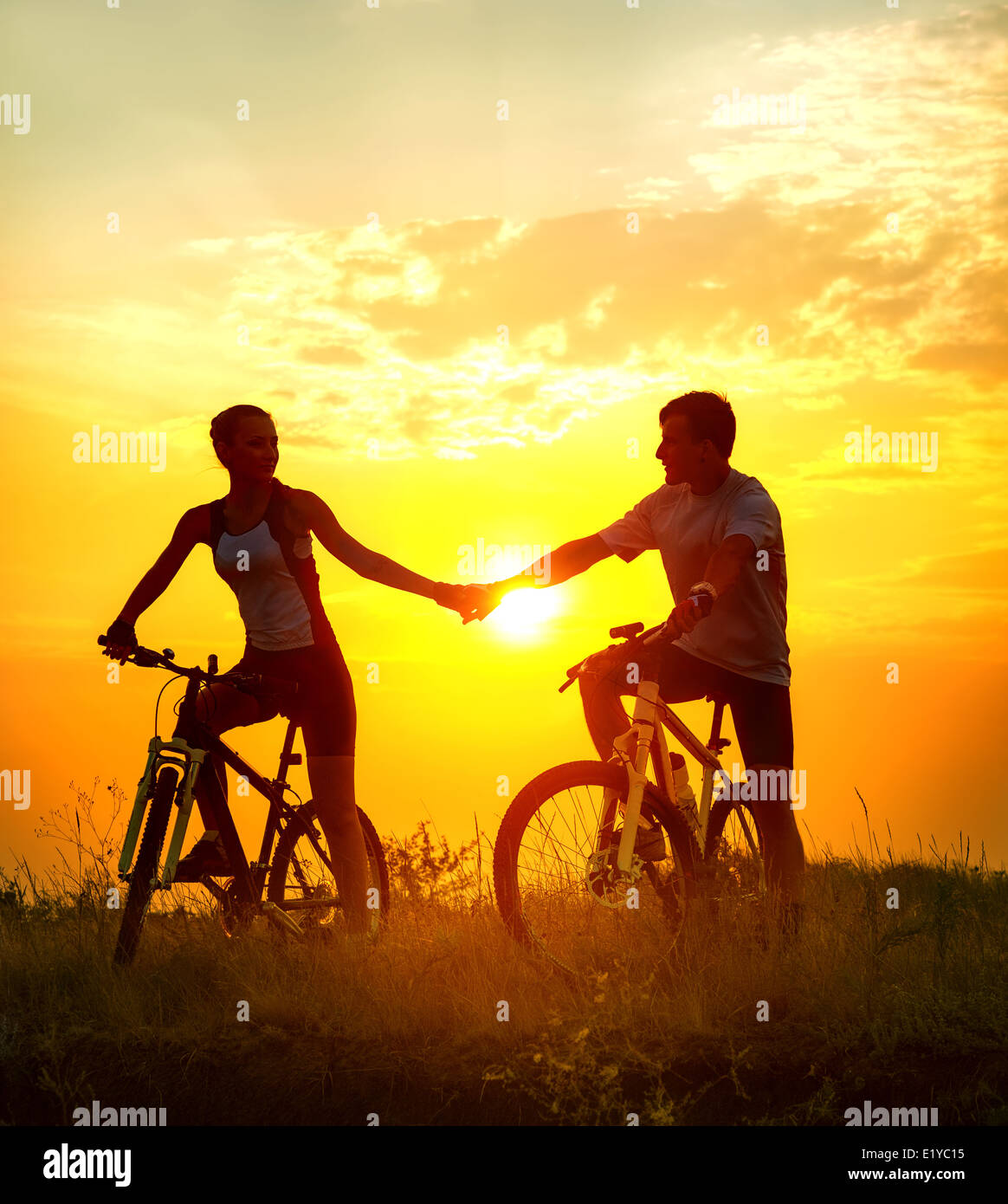 Couple on bicycles Stock Photo - Alamy