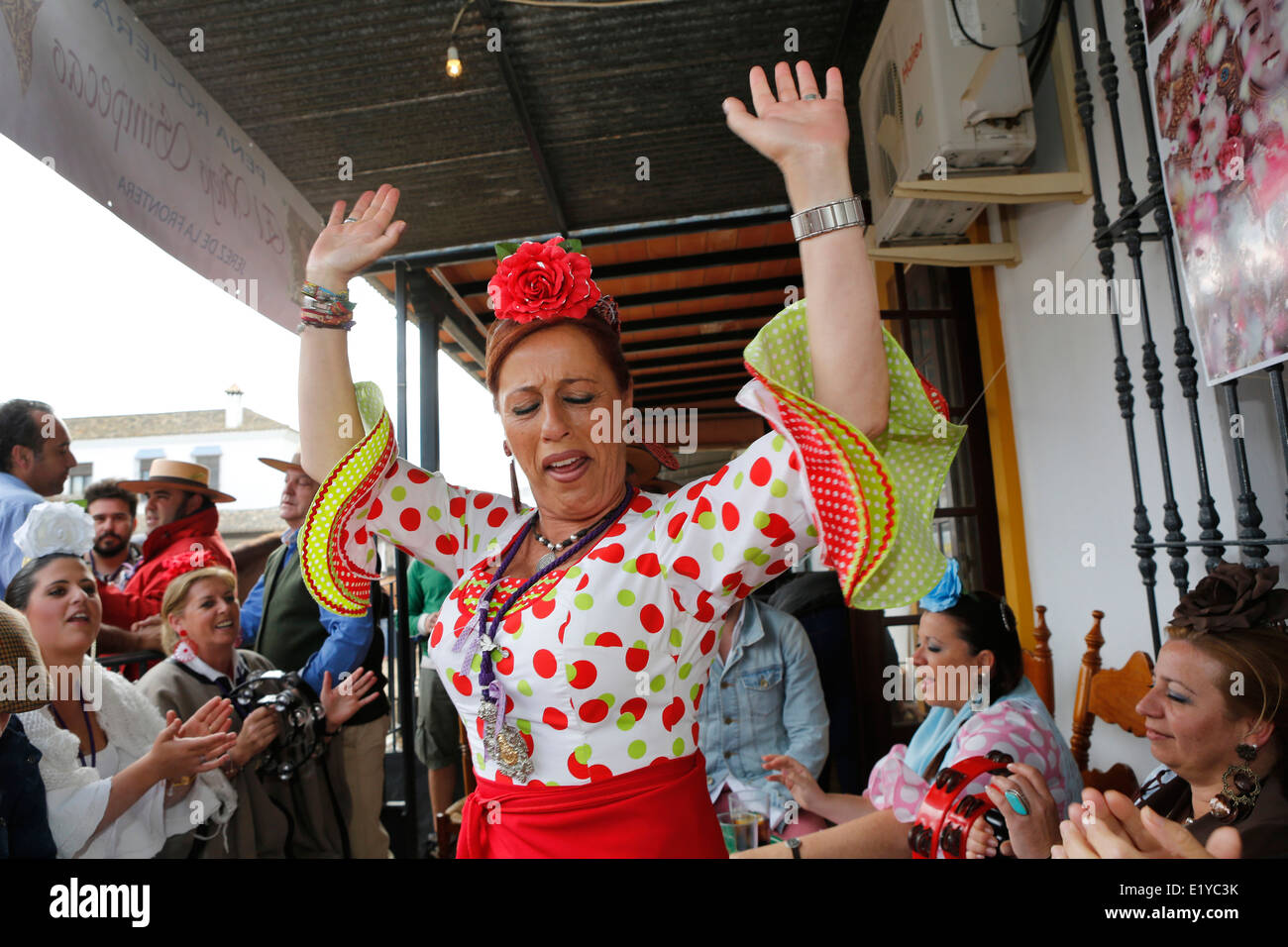 Woman dancing Andalusian style at the Rocio Romeria Catholic festival ...