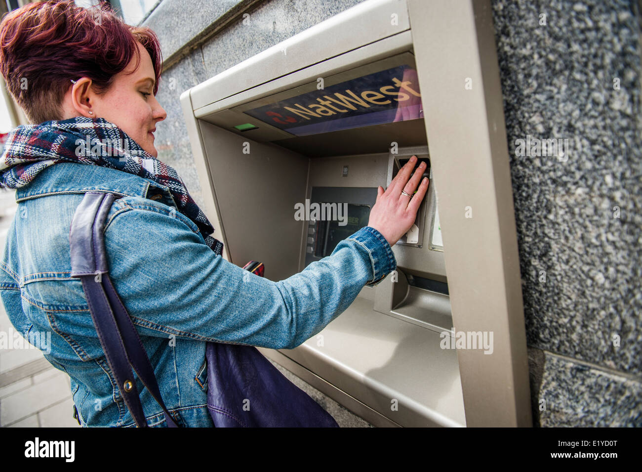 Withdrawing money from a cash dispenser hi-res stock photography and ...