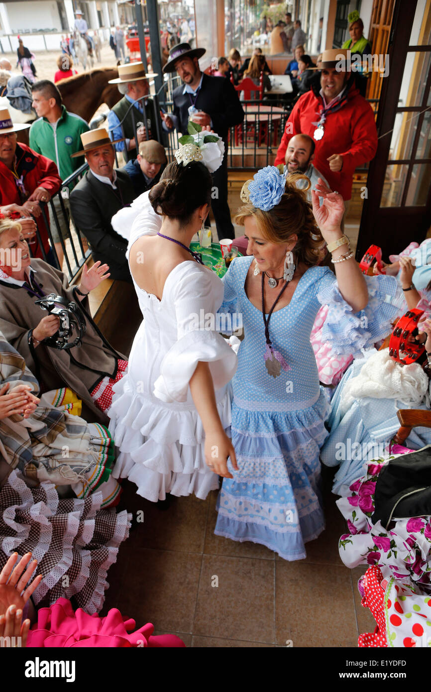Woman dancing Andalusian style at the Rocio Romeria Catholic festival ...