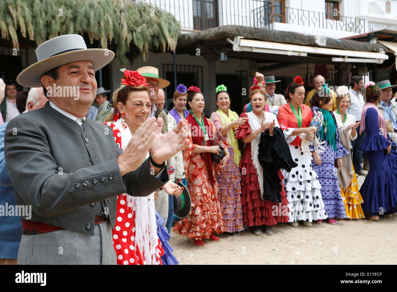Rocio Romeria - man on hobby horse re-enacts bull fight with other men ...