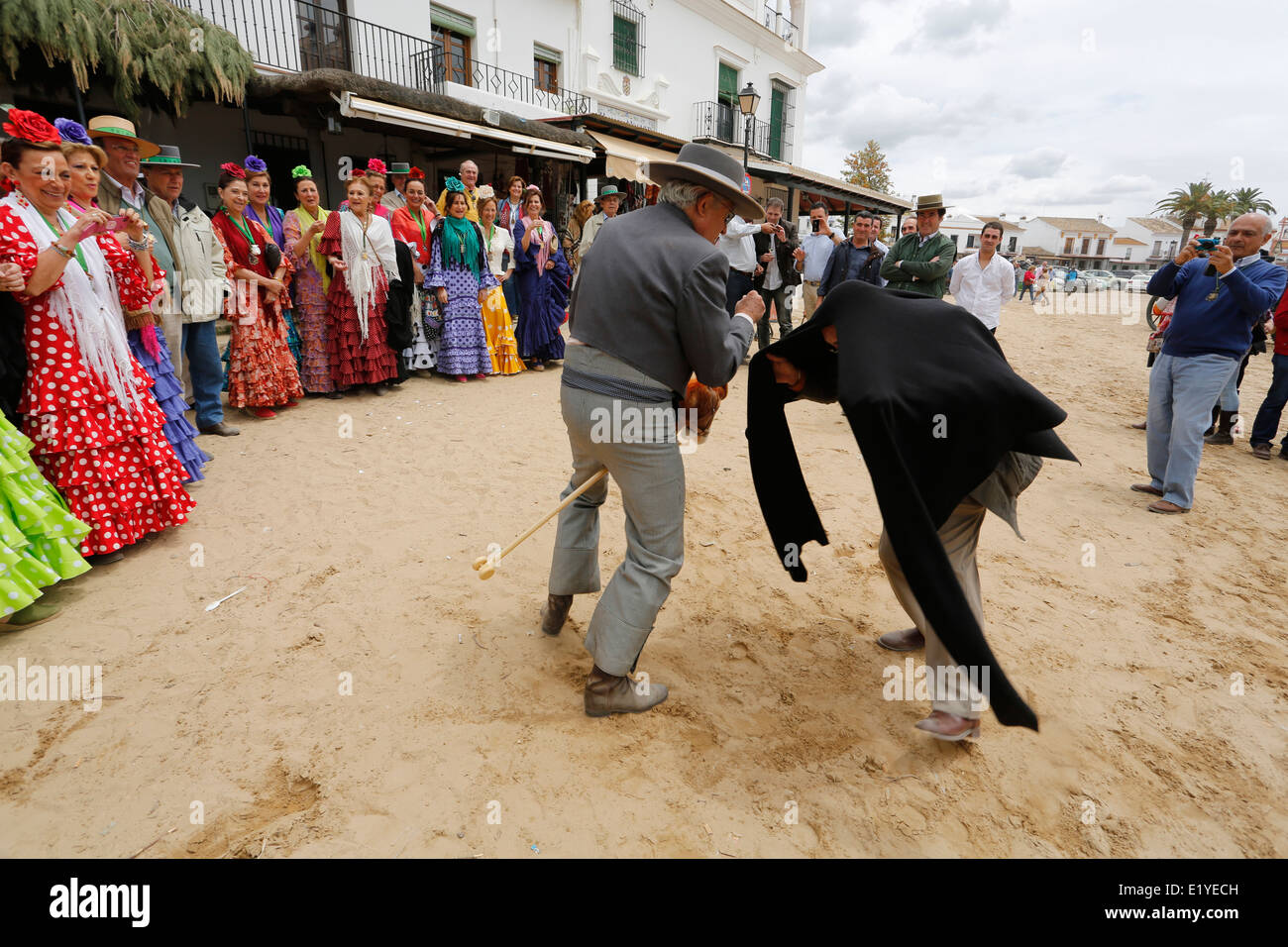 Rocio Romeria - man on hobby horse re-enacts bull fight with other men ...