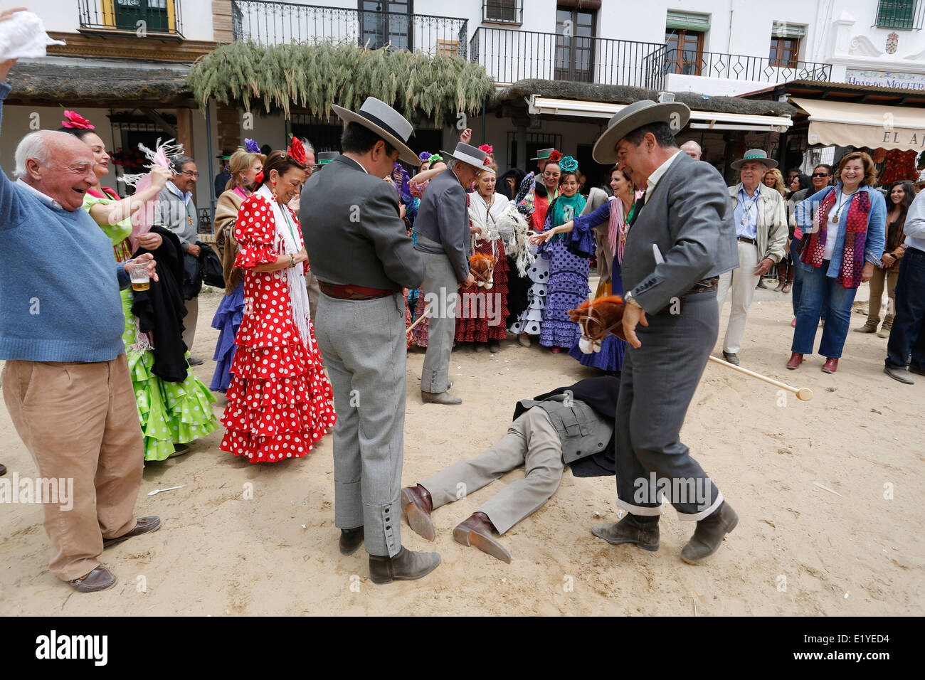 Rocio Romeria - man on hobby horse re-enacts bull fight with other men ...