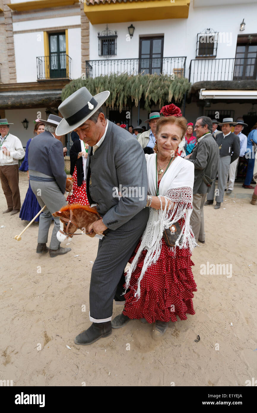 Rocio Romeria - man on hobby horse re-enacts bull fight with other men ...