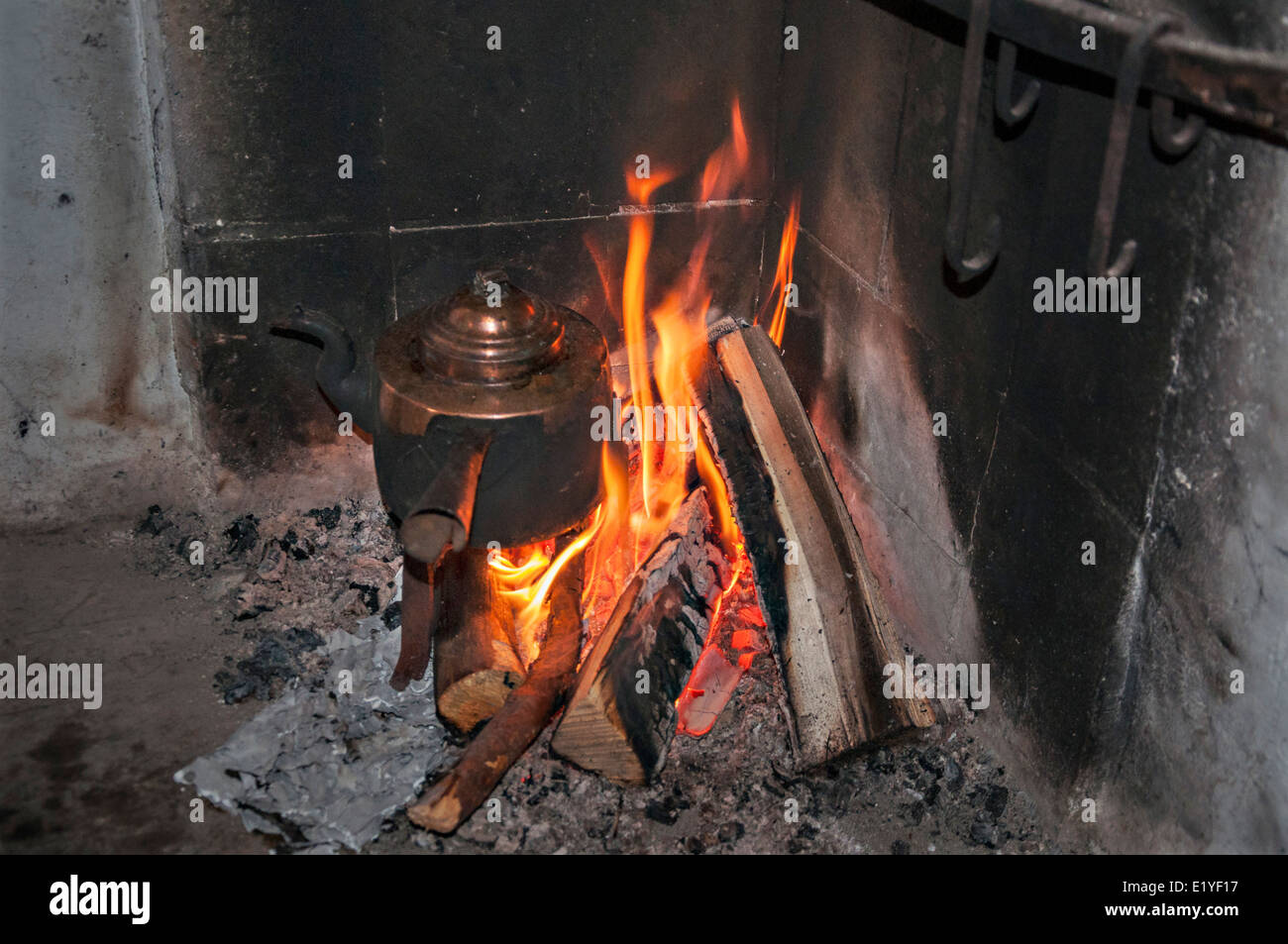 Fire burning in the chimney at an old farmhouse Stock Photo - Alamy