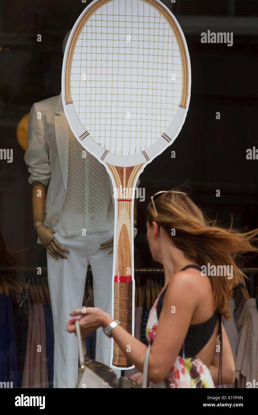 Wimbledon London, 11th June 2014. A Pedestrian walks past a tennis ...