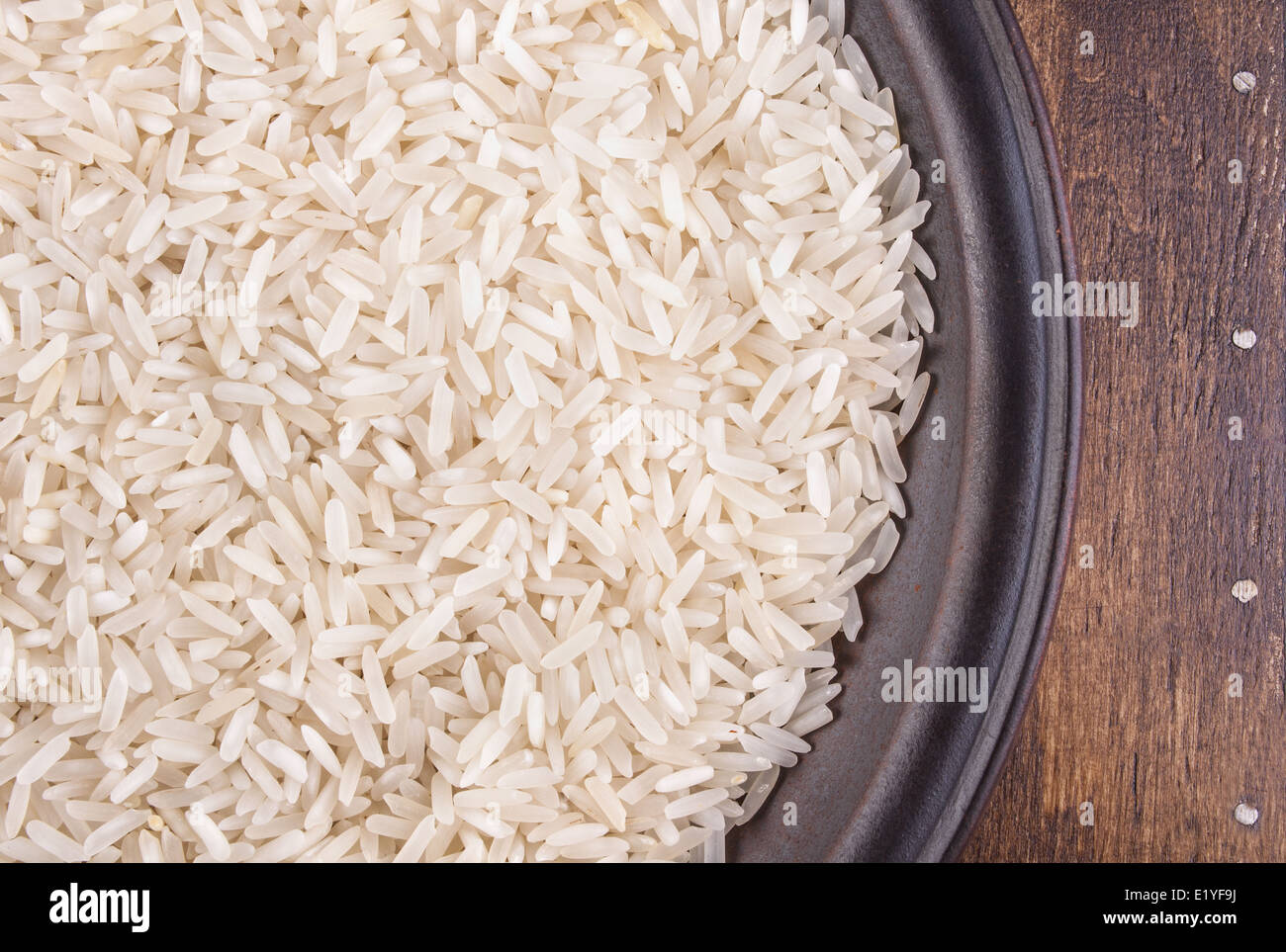 Plate of Rice on Wood Background Stock Photo - Alamy