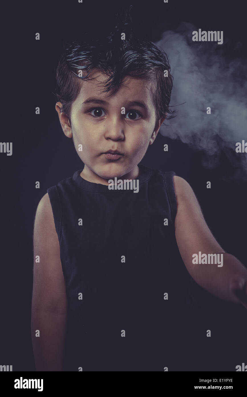 metal boy dressed rocker with funny faces Stock Photo - Alamy