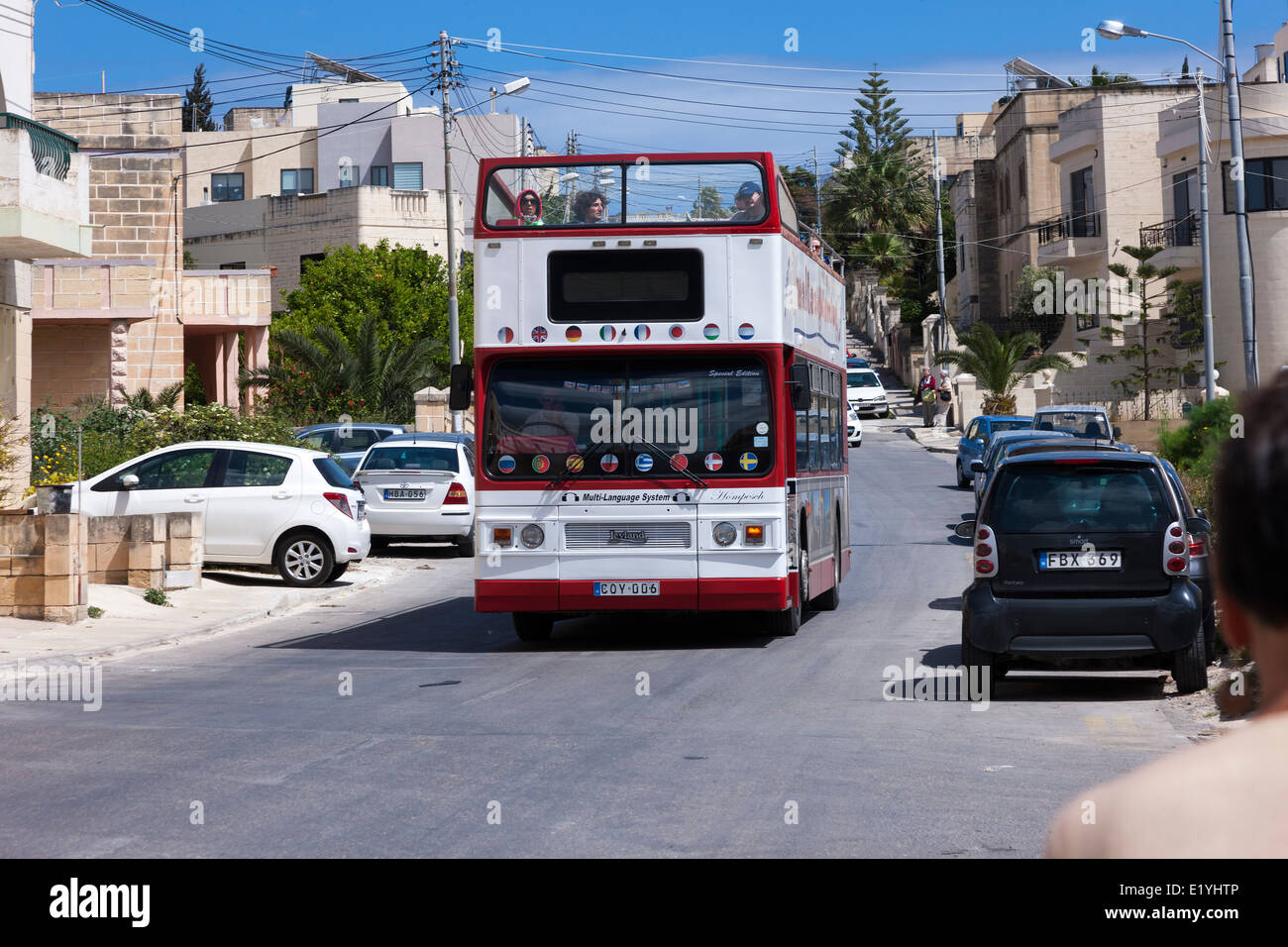 A hop on hop off bus in Marsaxlokk, Malta Stock Photo - Alamy