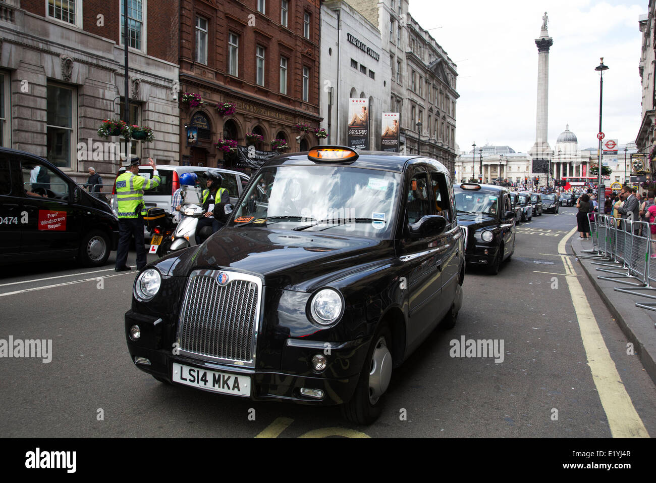 London, UK..11th June 2014. Black taxi drivers protest against taxi ...