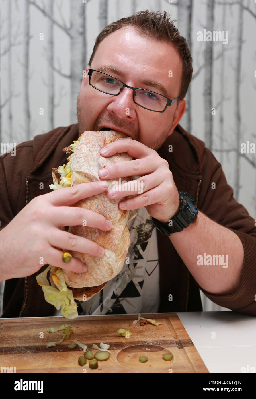 Man eating a huge Sandwich Stock Photo - Alamy