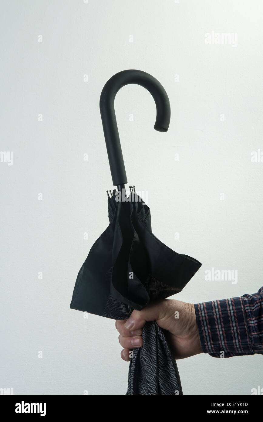 umbrella on hand Stock Photo - Alamy