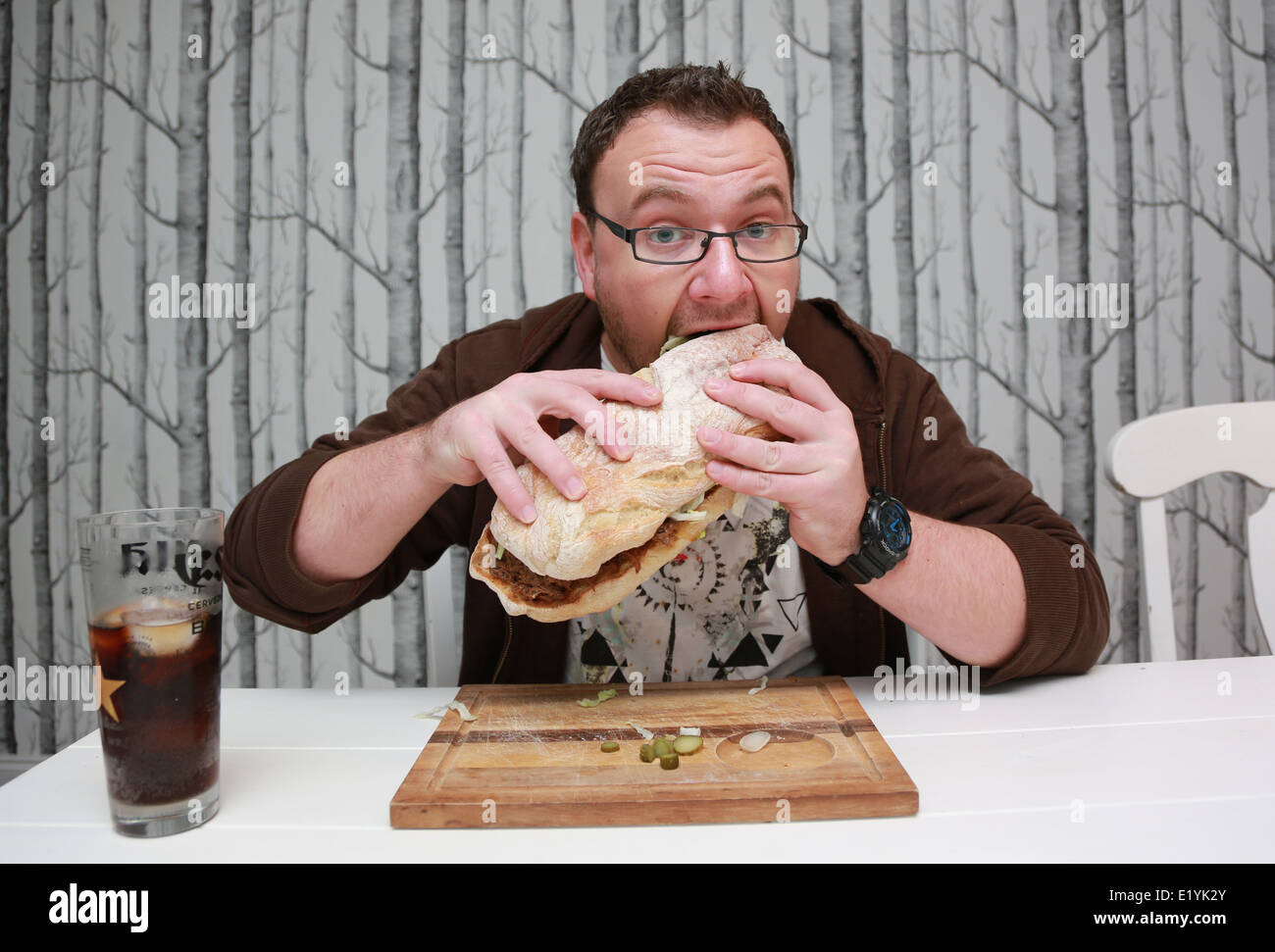 Fat guy eating hi-res stock photography and images - Alamy