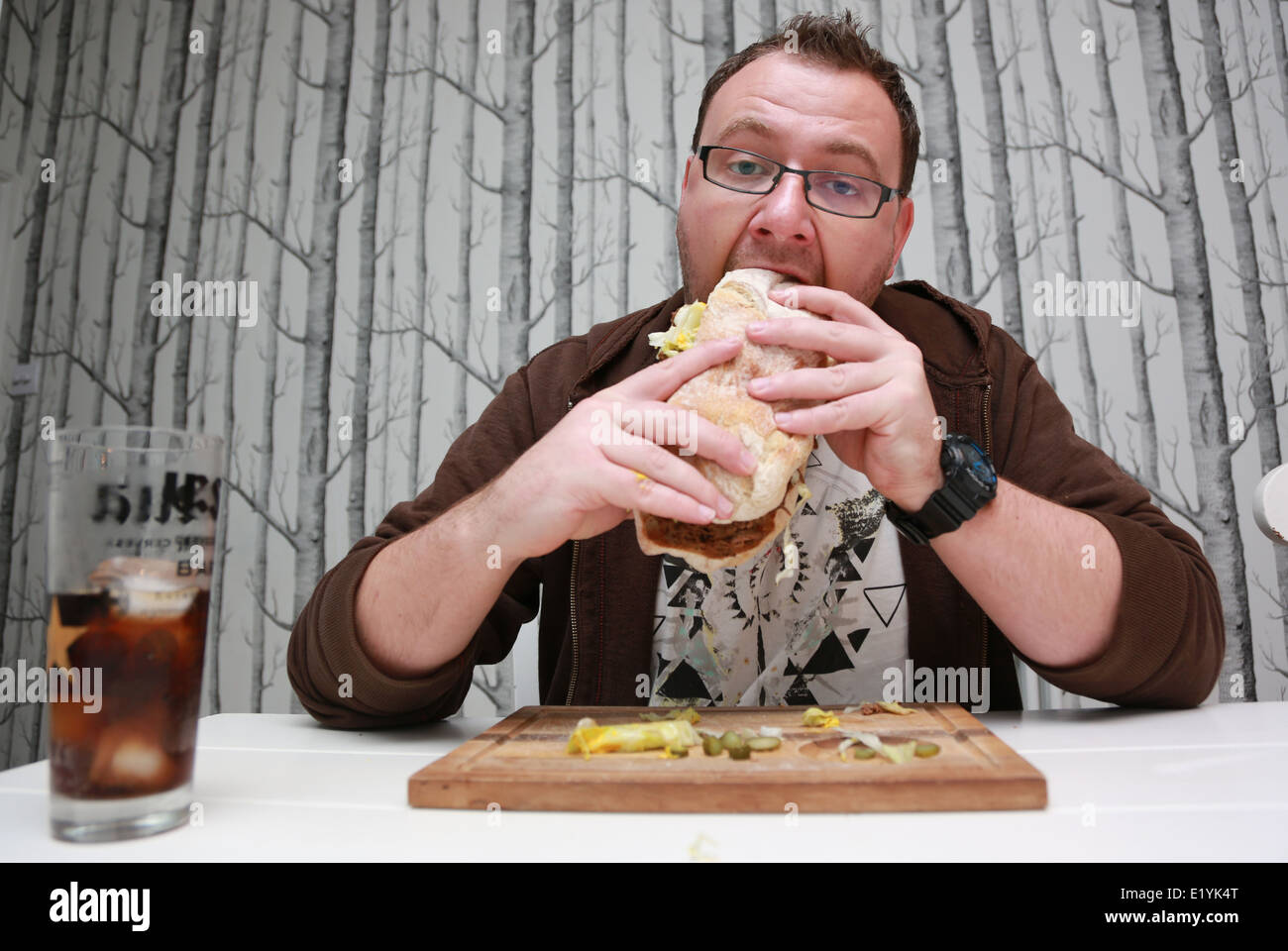 Man eating a huge Sandwich Stock Photo - Alamy