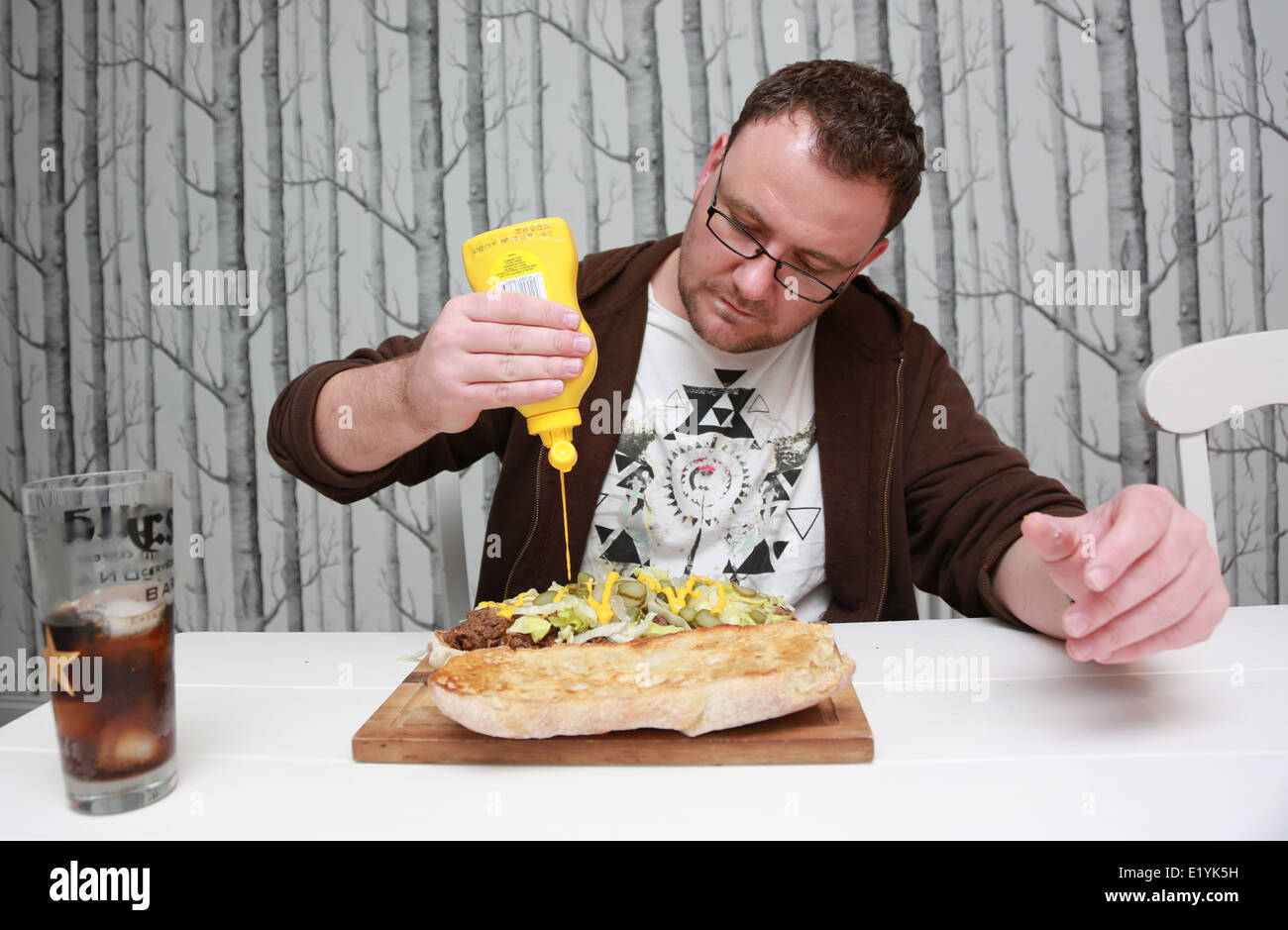 Man eating a huge Sandwich Stock Photo - Alamy