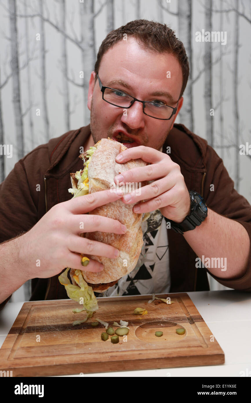 Man eating a huge Sandwich Stock Photo - Alamy