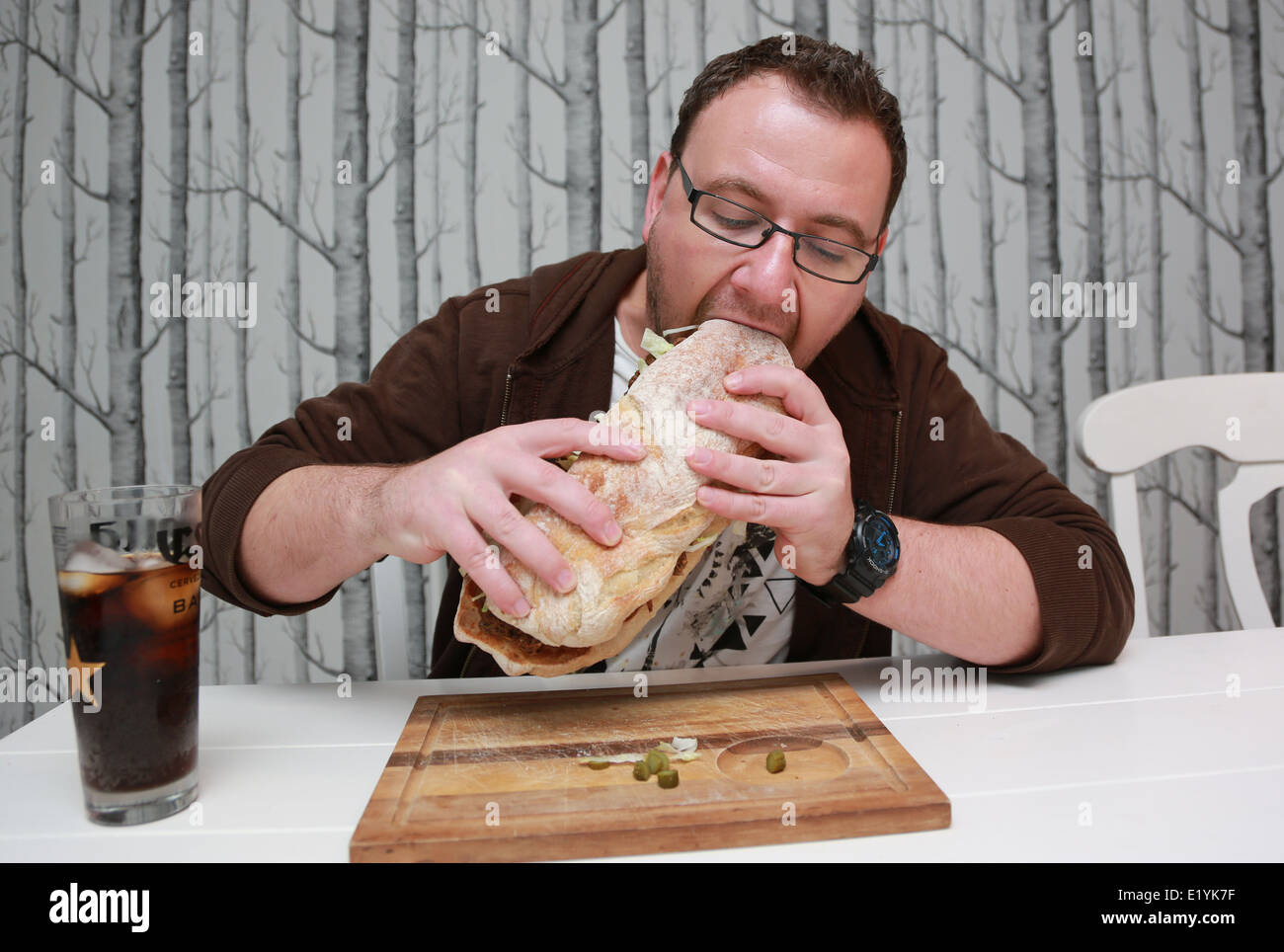 Man eating a huge Sandwich Stock Photo - Alamy