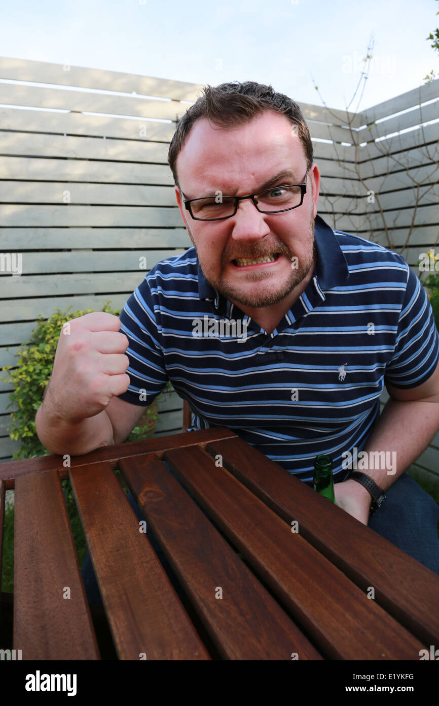 Angry Man Drinking Stock Photo - Alamy