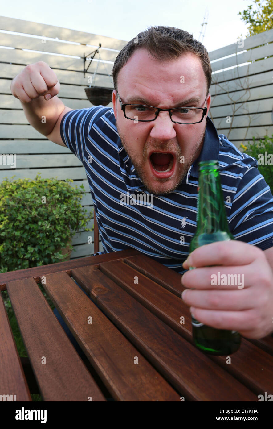 Angry Man Drinking Stock Photo - Alamy