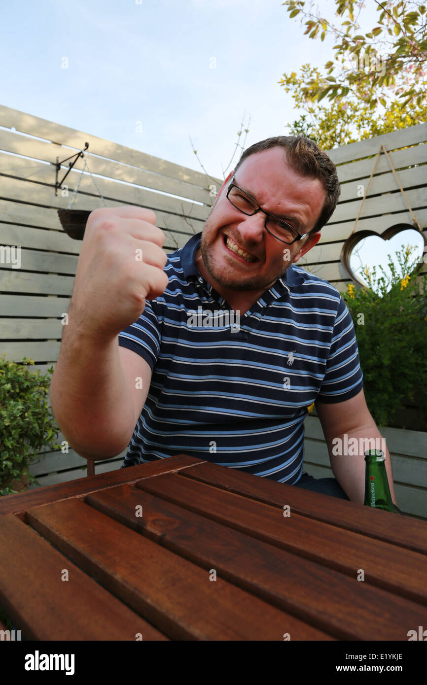 Angry Man Drinking Stock Photo - Alamy