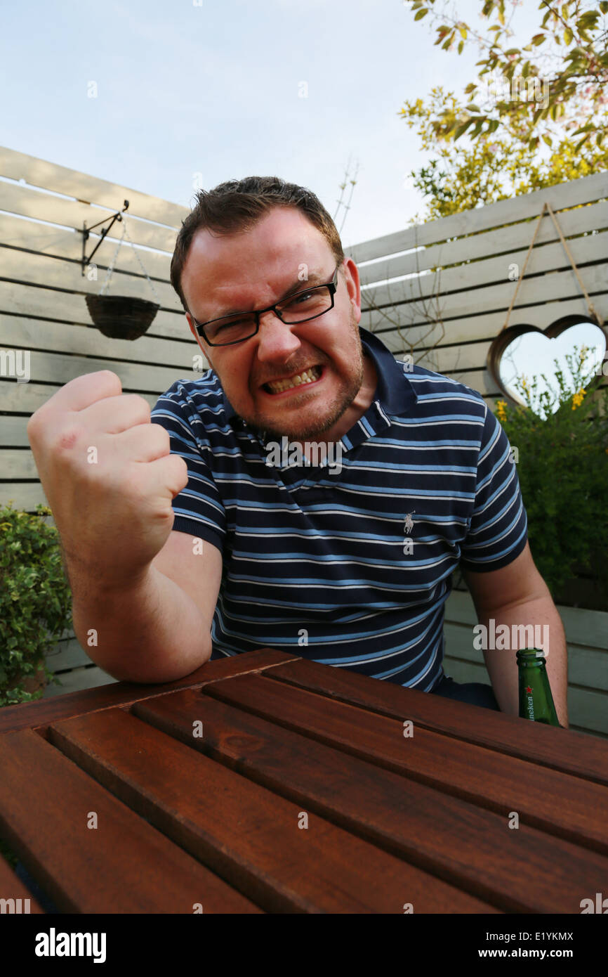 Angry Man Drinking Stock Photo - Alamy